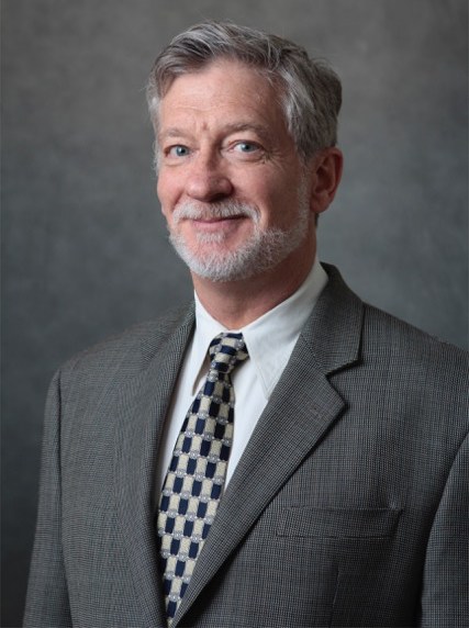 Dr. Kevin Muench DMD, MAGD Dentist Qualifications